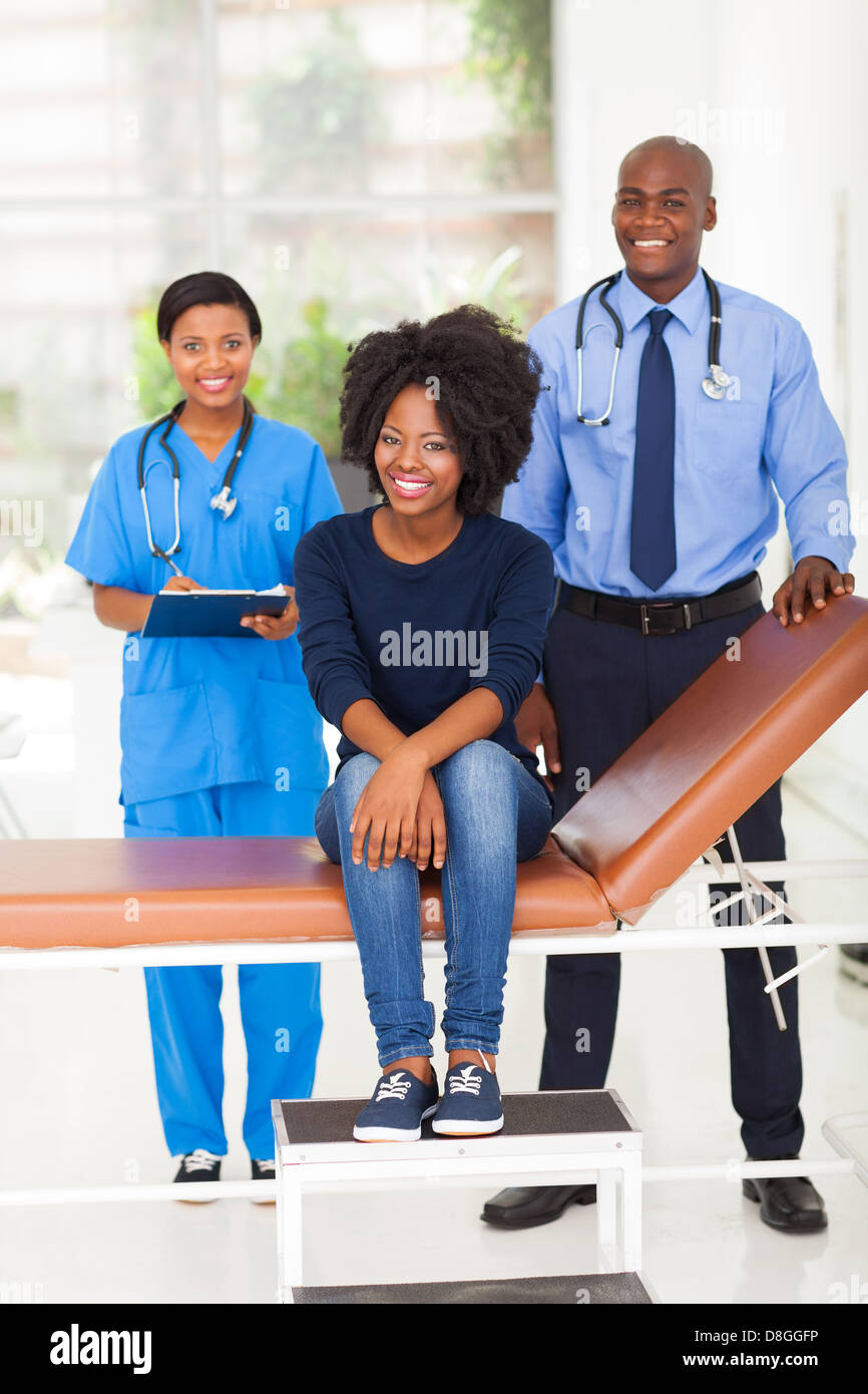 young African woman in doctor's office with doctor and nurse Stock Photo - Alamy