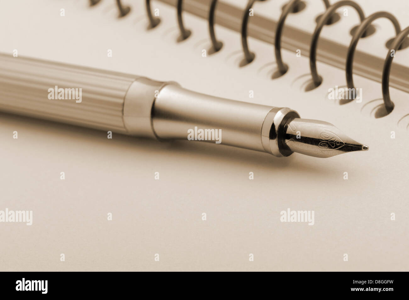 Fountain pen on a yellow notebook Stock Photo - Alamy