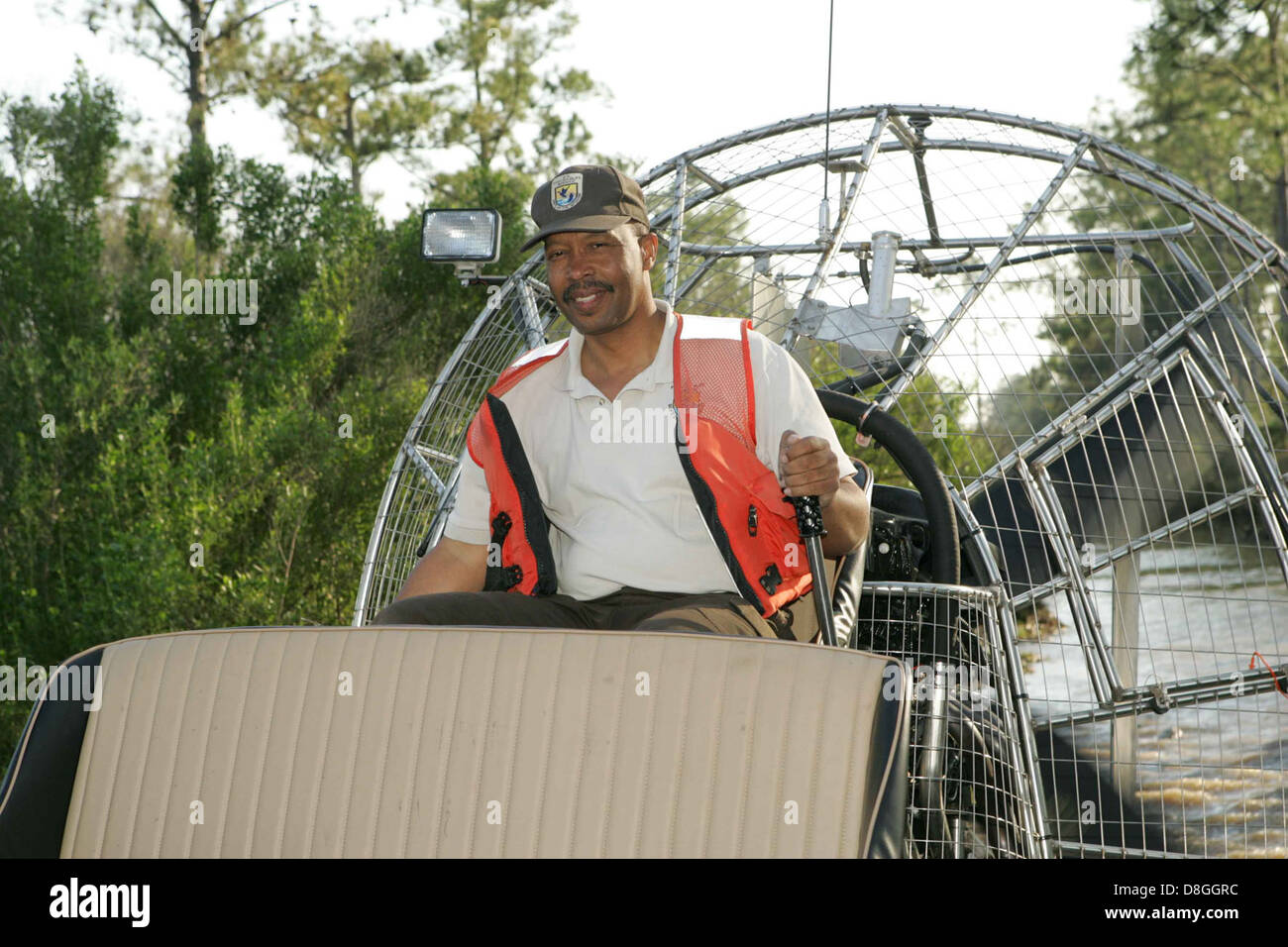 Adults man ranger rides in airboat Stock Photo - Alamy