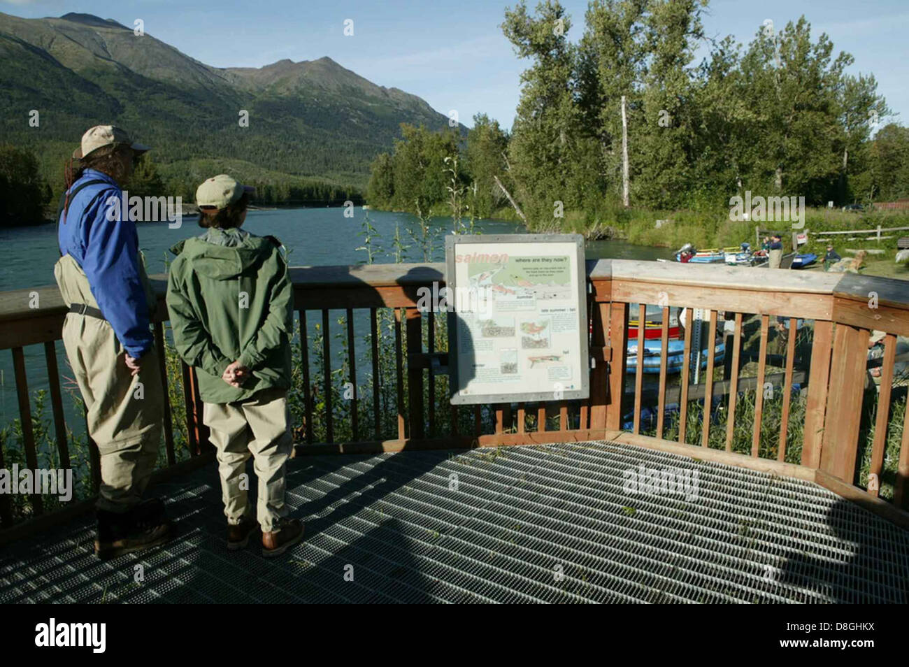 Anglers reading educational materials about the life cycle of the red ...