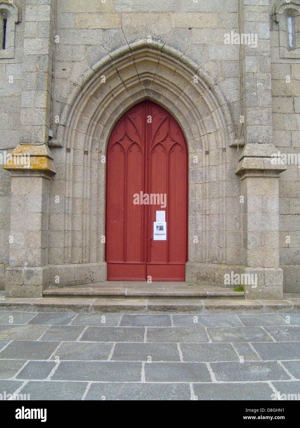 A classic Anglican church door, typically made of wood or stone ...