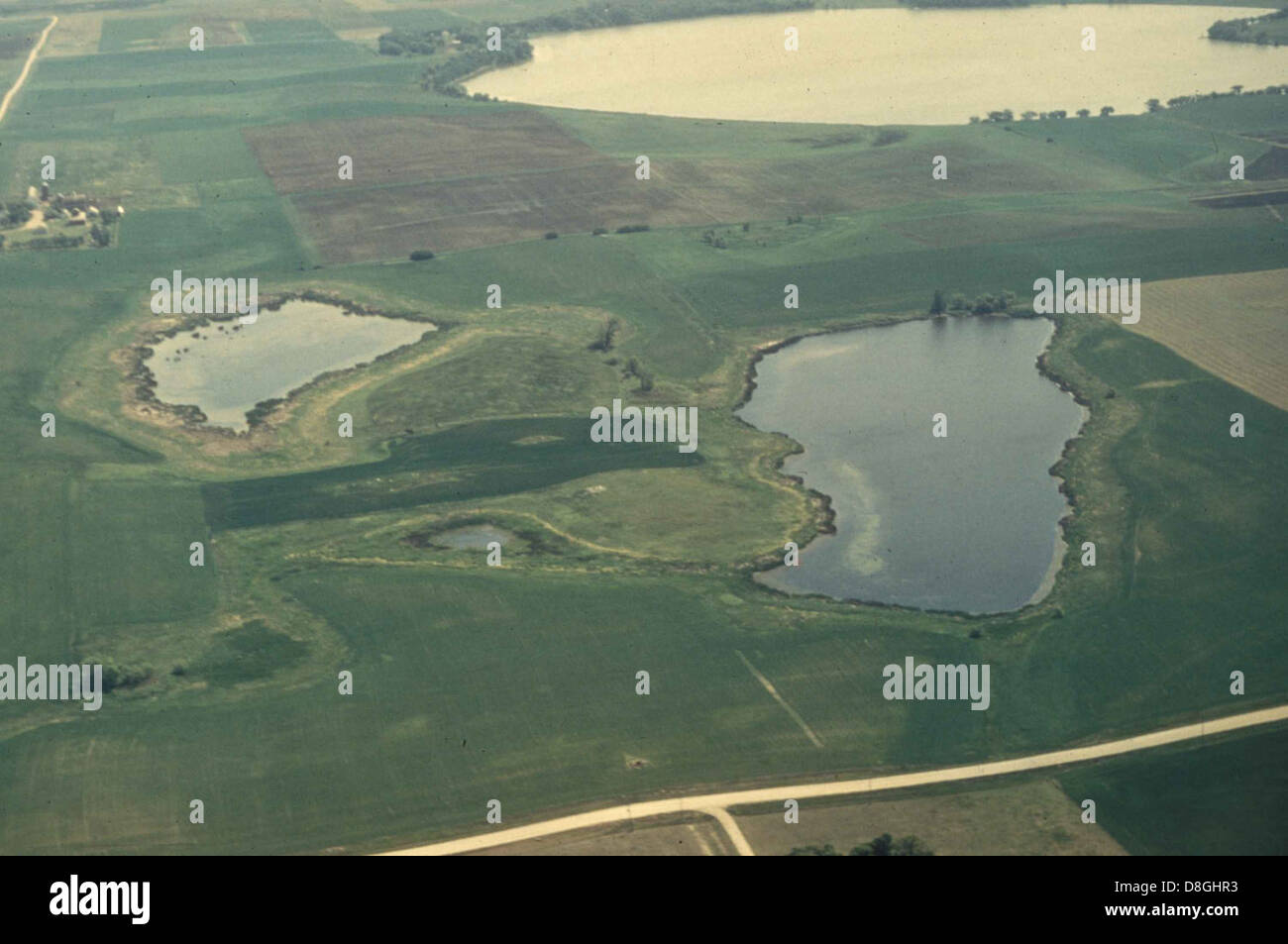 This aerial image shows a large pothole in Minnesota, illustrating its ...