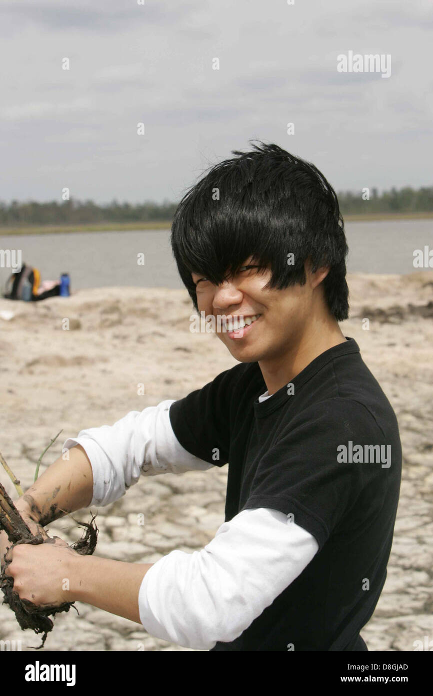 A close-up image of an Asian man’s face, showing facial features ...