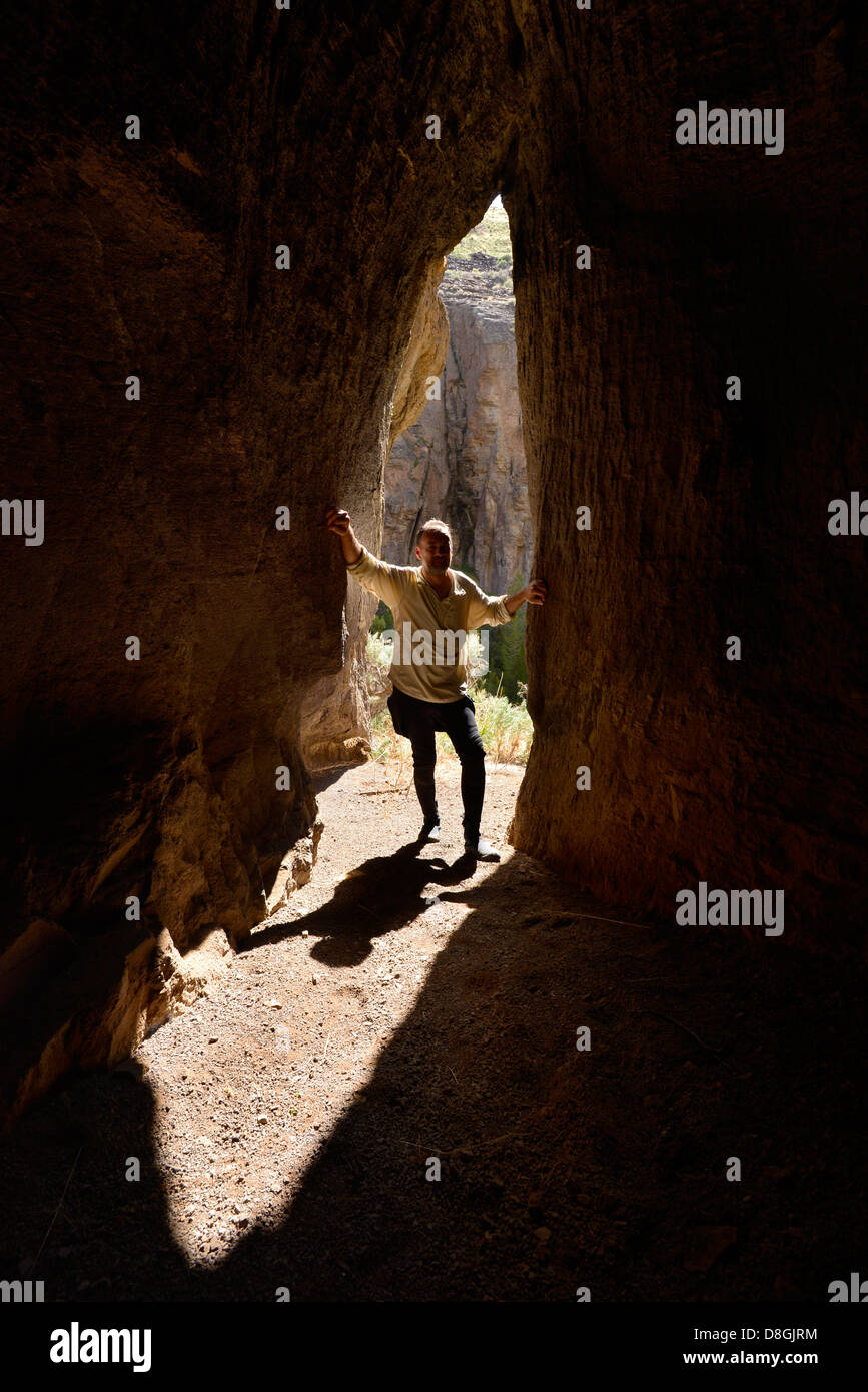 Hiker in mouth of cave, Jarbidge Canyon, Idaho Stock Photo - Alamy