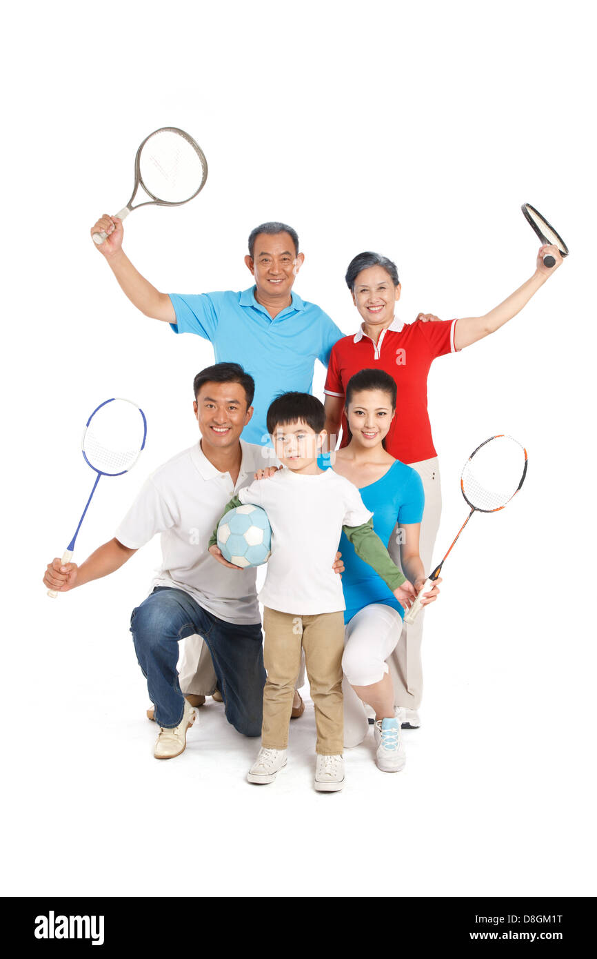 Whole family holding racket Stock Photo - Alamy