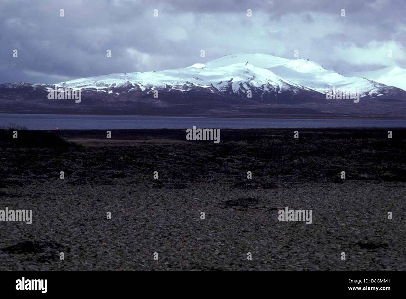 Becharof Lake, located in Alaska, is shown with a stunning glacier ...