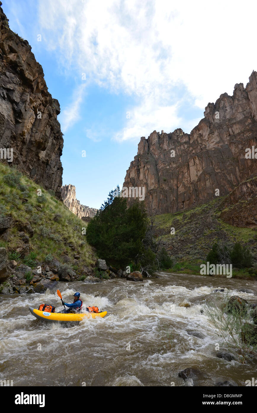 Paddling an inflatable kayak down a rapid on the Jarbidge River, Utah ...