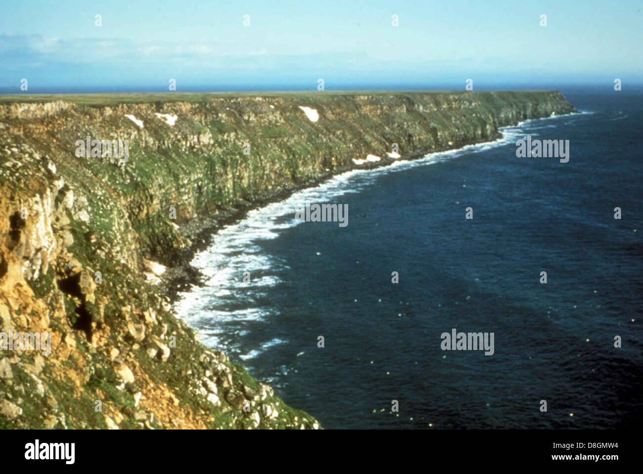 This image shows the rugged cliffs along the Bering Sea coastline. The ...
