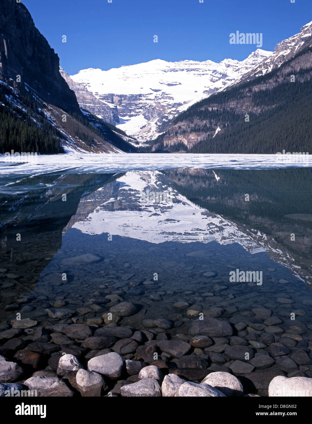 View across a partly frozen Lake Louise, Banff National Park, Alberta ...