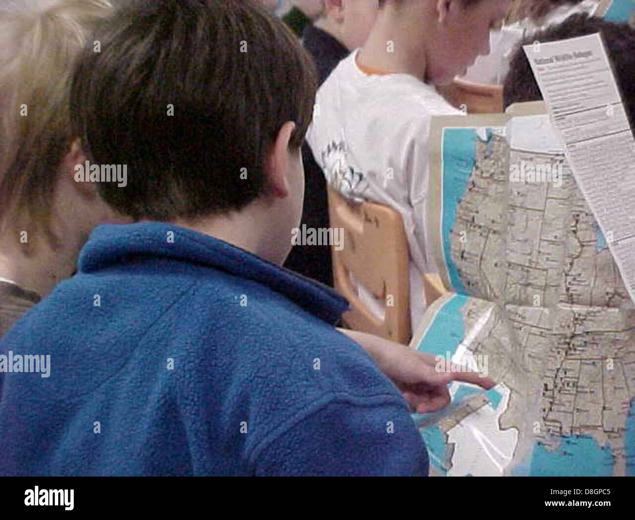 Boy looks at map Stock Photo - Alamy