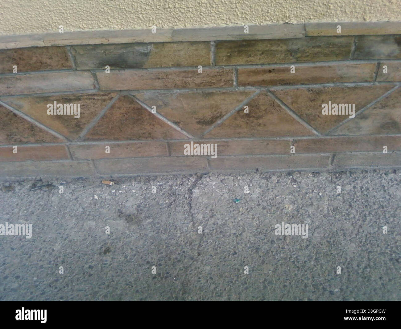 A front wall of a house made from carefully arranged bricks, creating a ...