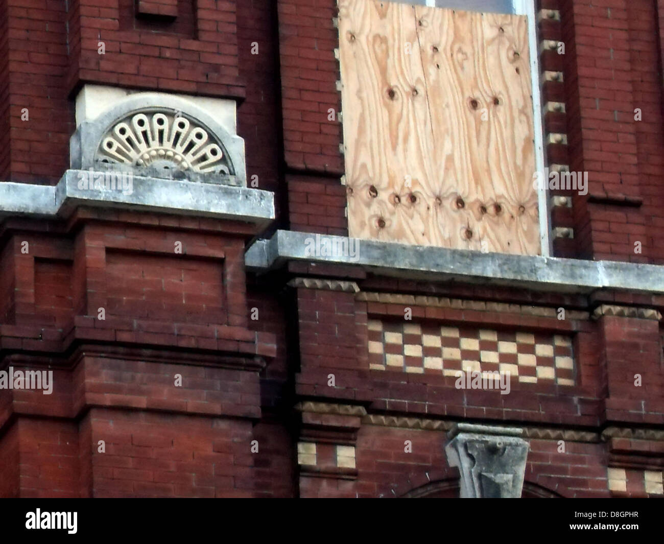 A brick storefront with large windows, showcasing the traditional ...