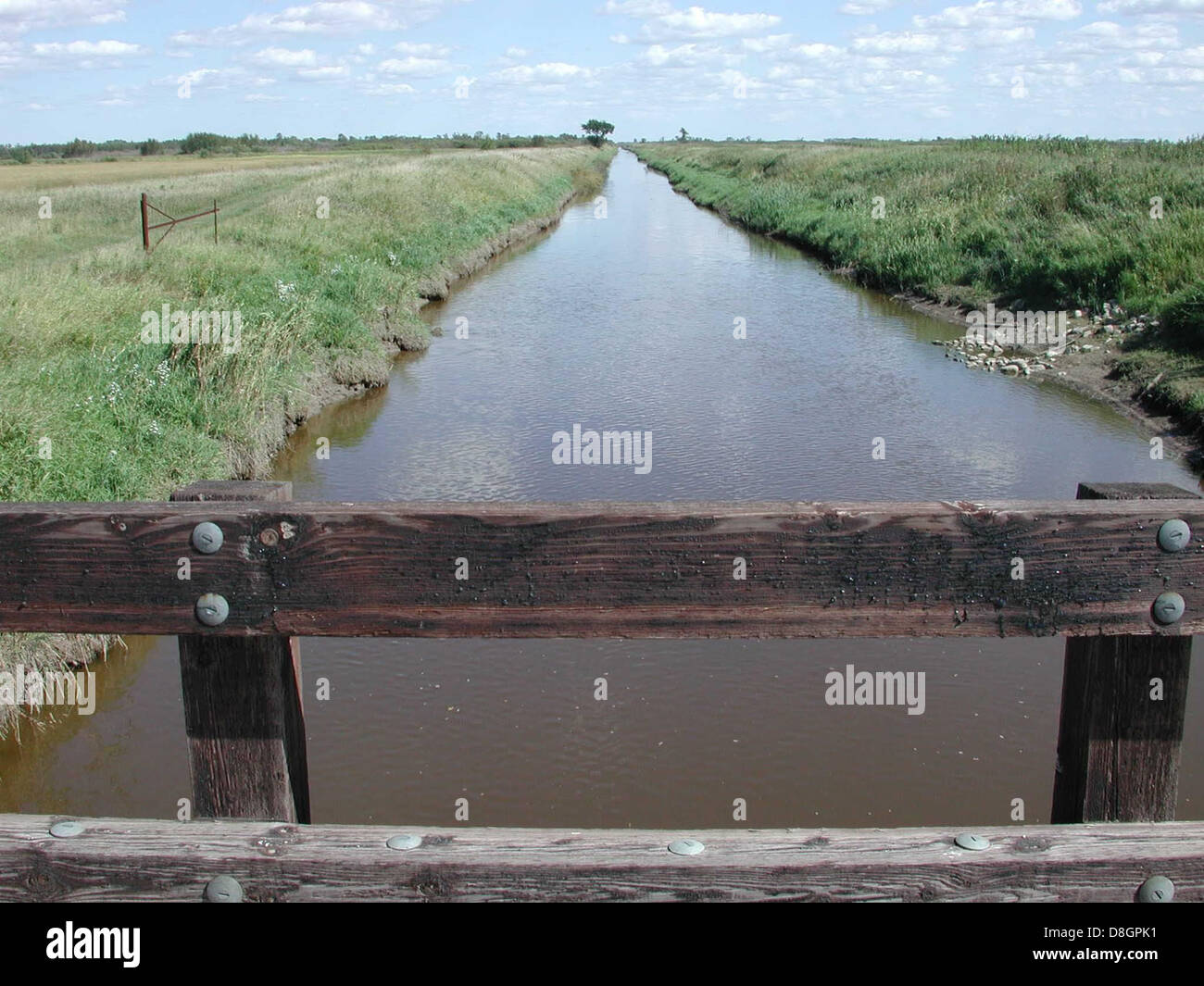 A bridge spans a small river, providing a pathway for crossing over the ...