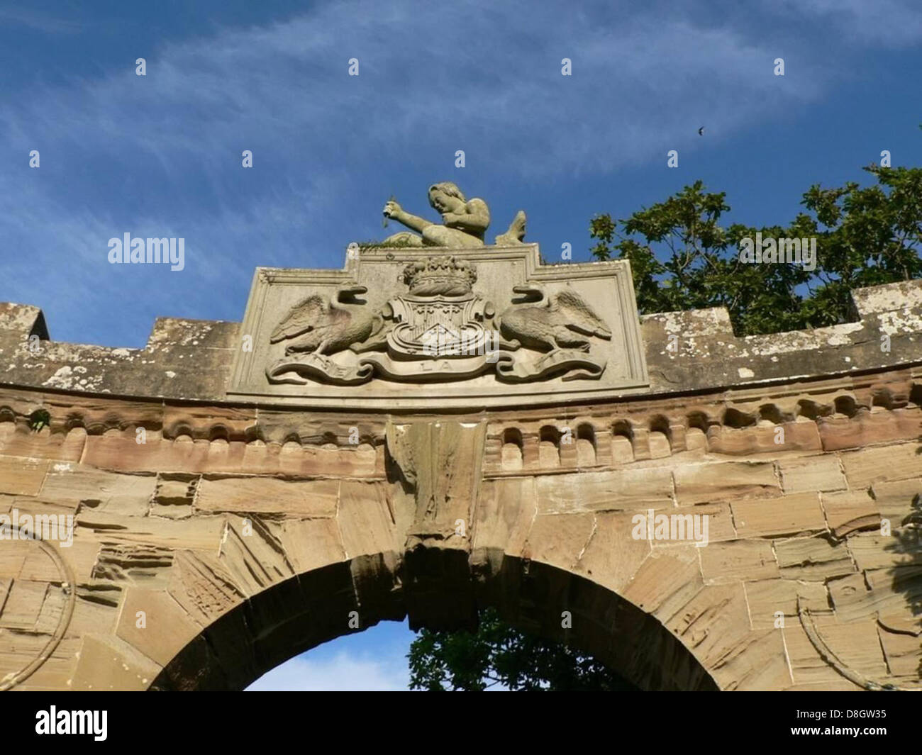 This image shows a heraldic-style emblem featuring a castle, commonly ...