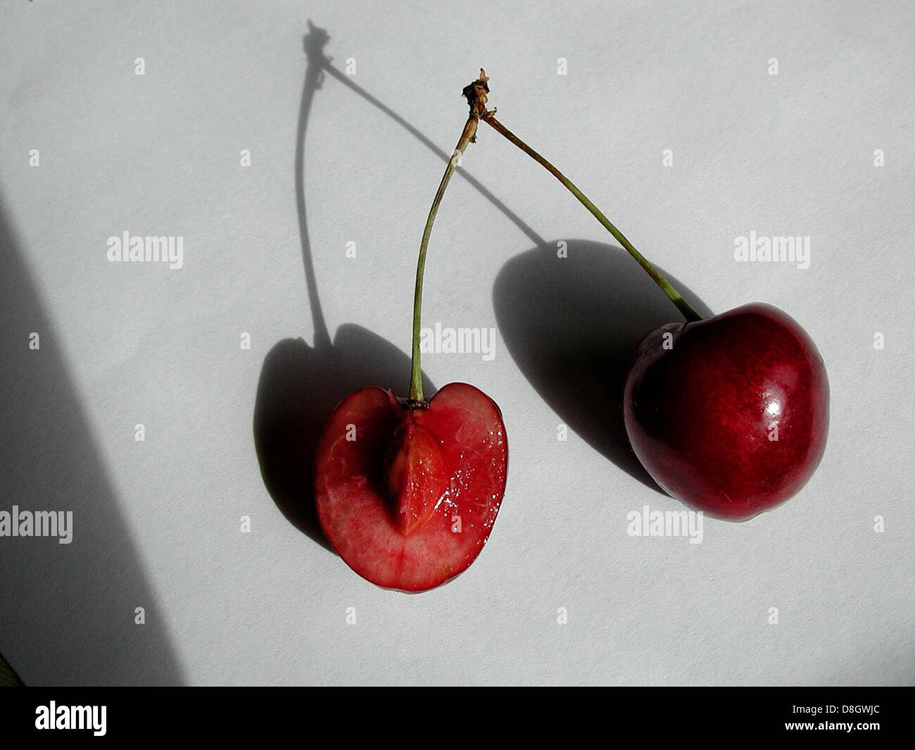 Cherry sliced fruit Stock Photo - Alamy