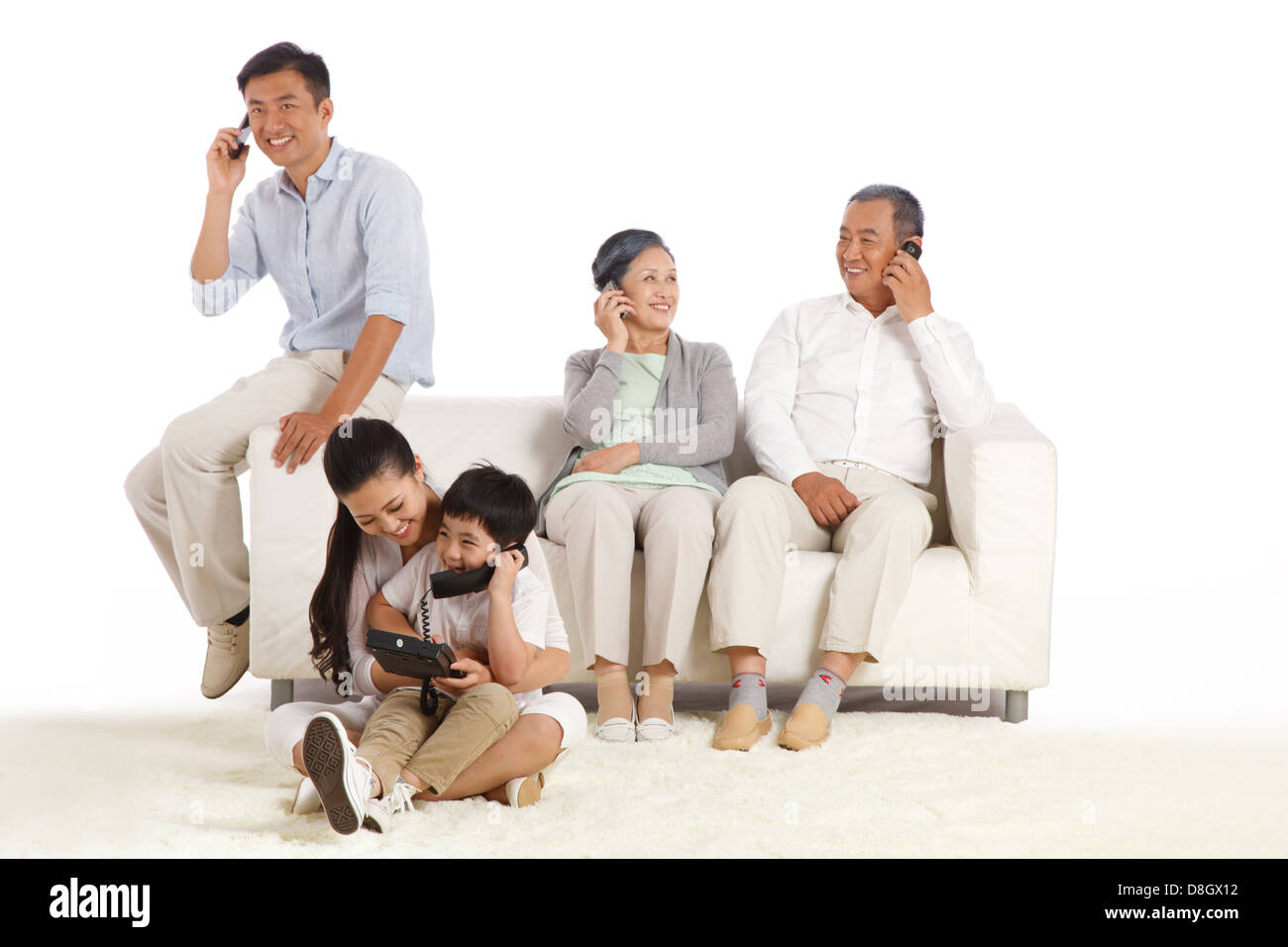 Whole family making phone call Stock Photo - Alamy