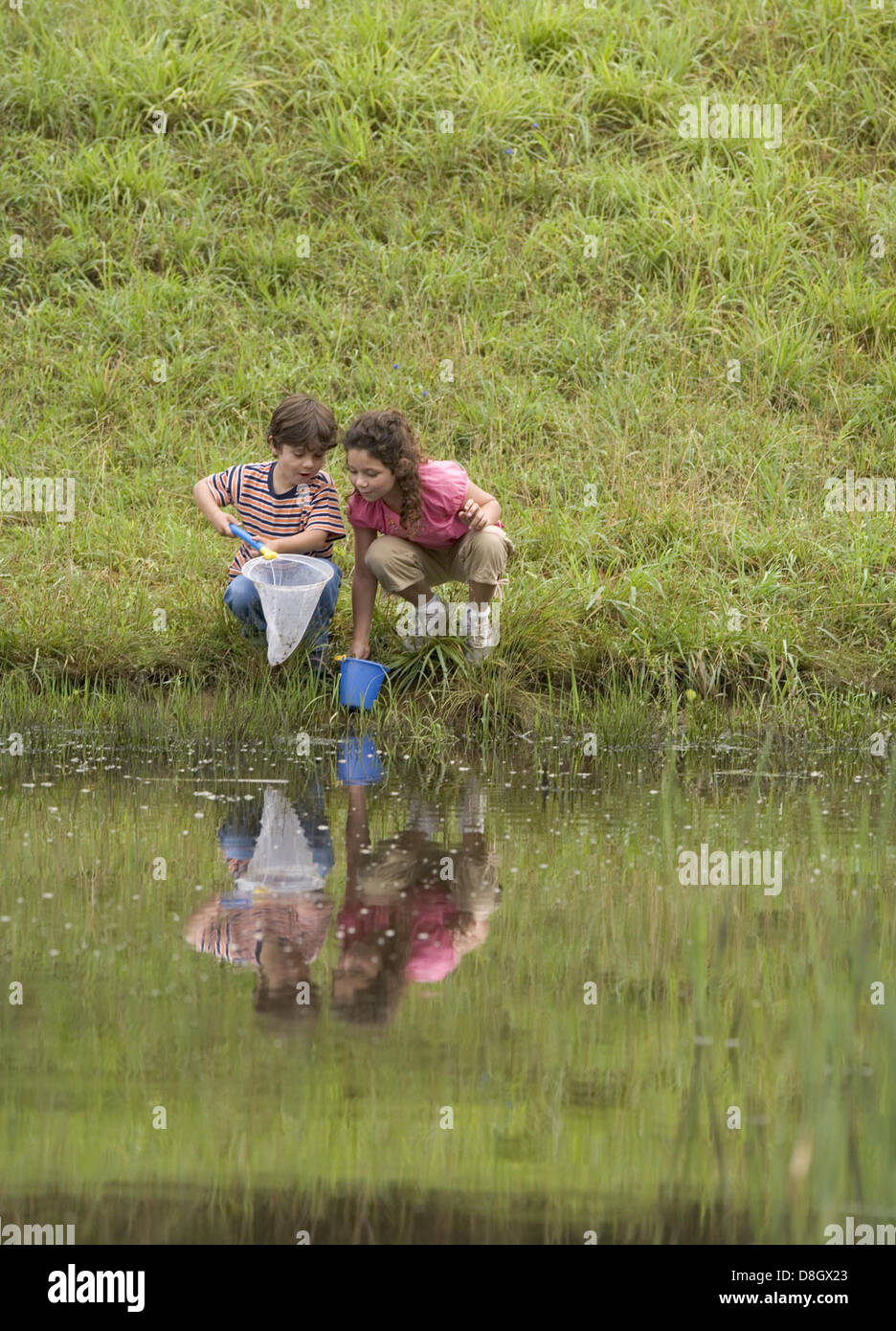 A stock photo of children playing on or near a river. The children are ...