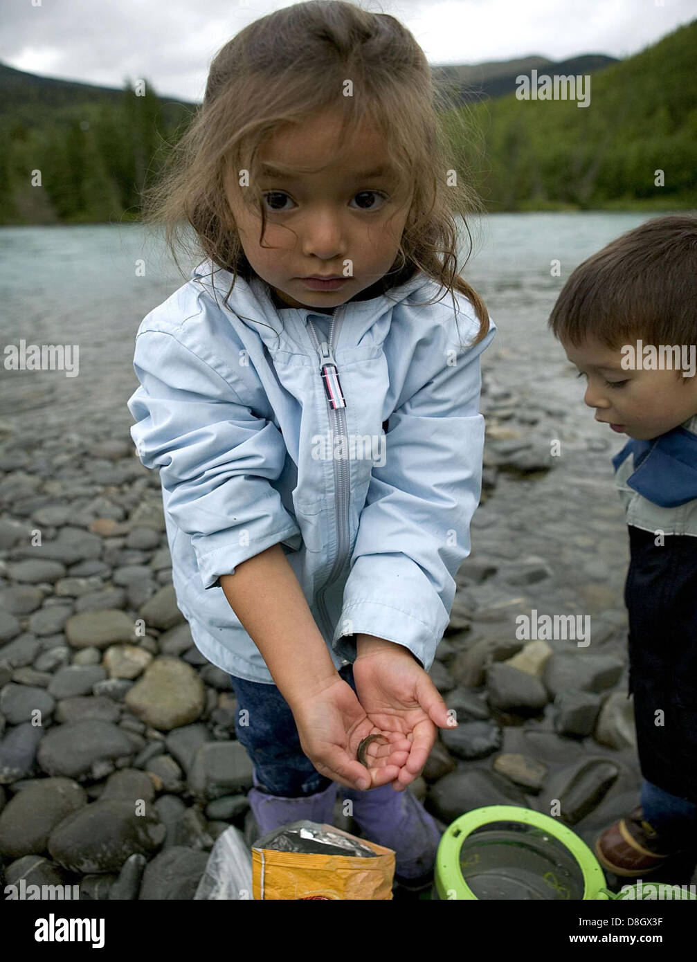 Children engaged in playful activity outdoors, showcasing their joyful ...