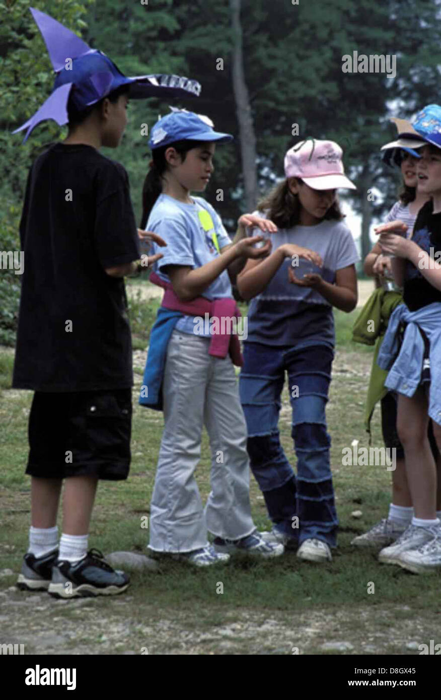 Children playing in a park, engaging in various outdoor activities like ...