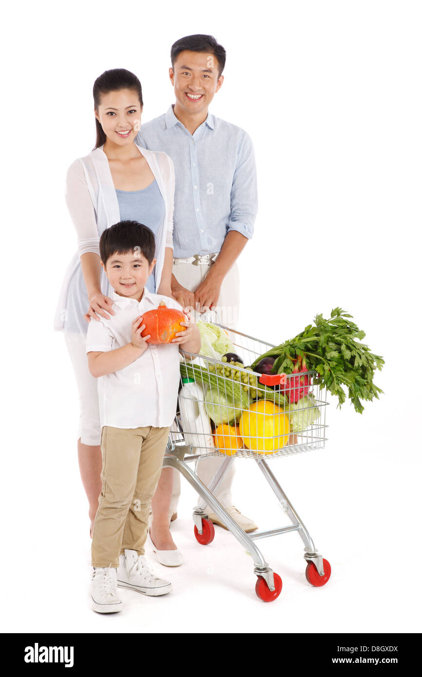 Family shopping with shopping cart Stock Photo - Alamy