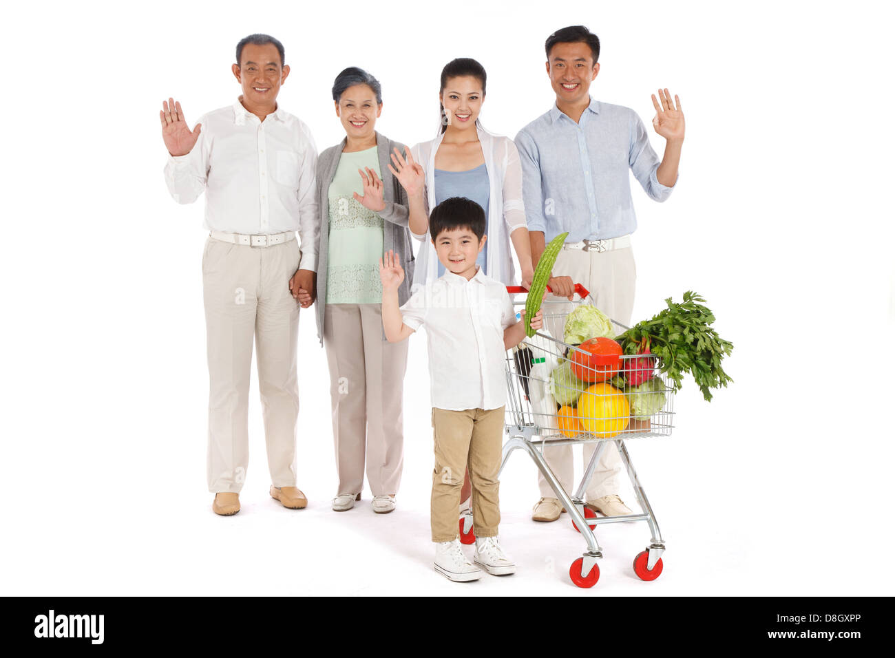 Whole family shopping with shopping cart Stock Photo - Alamy