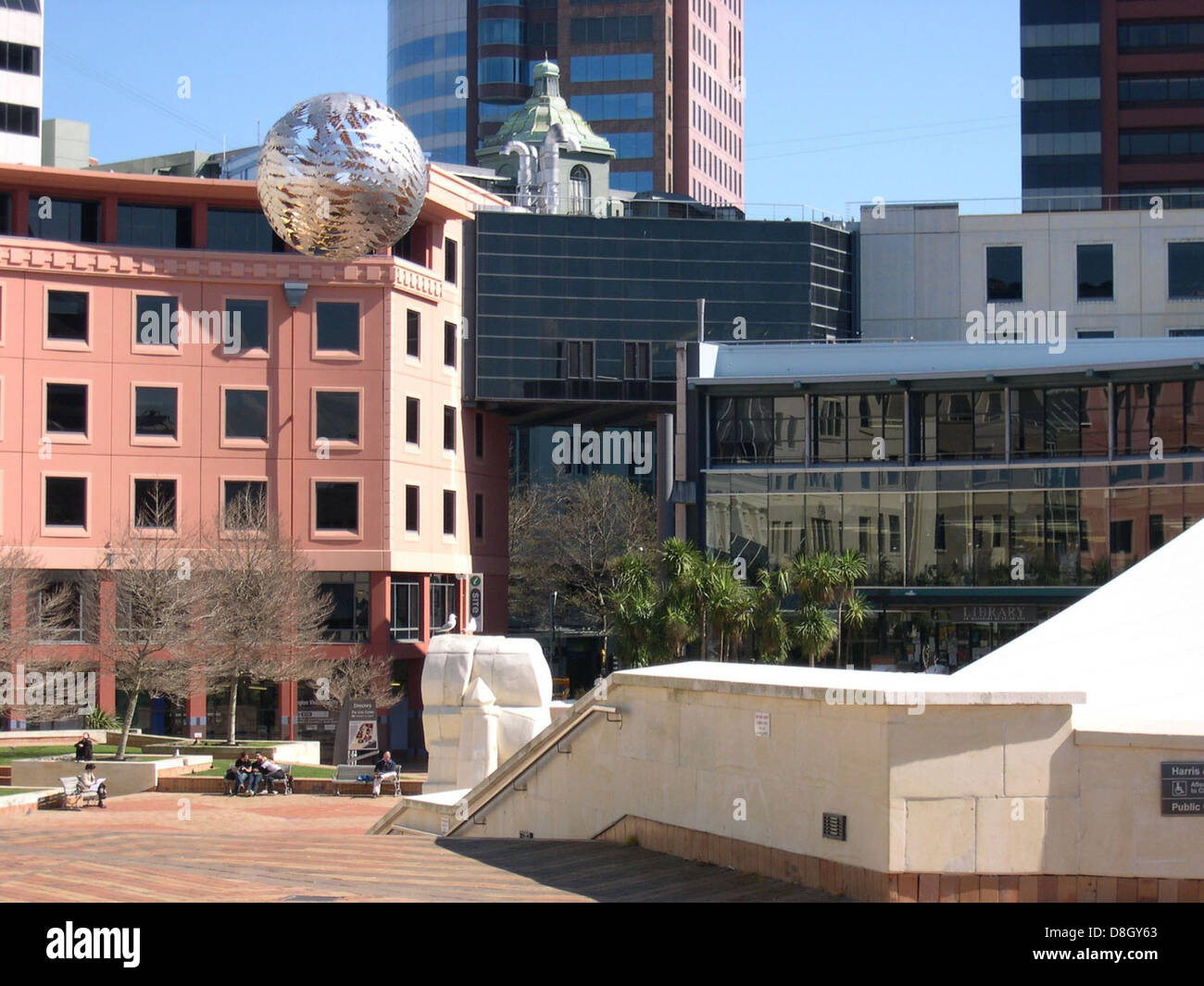 A civic square featuring a large suspended sculpture by Neil Dawson ...