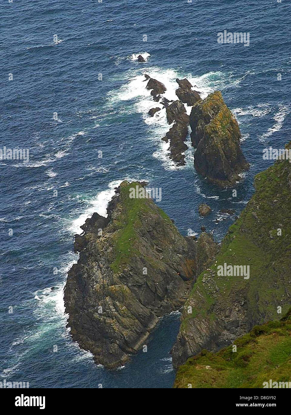 A breathtaking view of rugged cliffs along the coast of Ireland ...