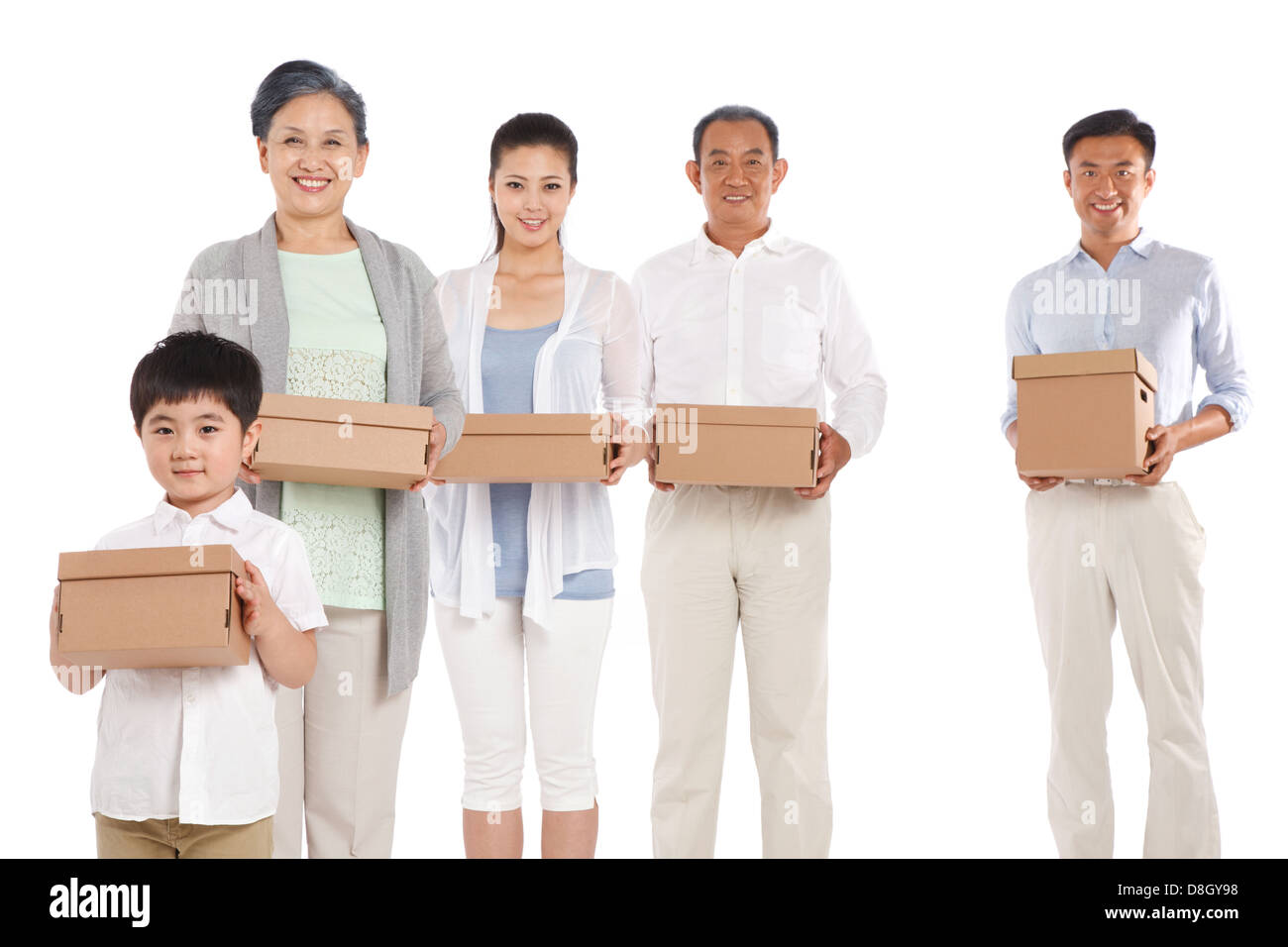 Whole family holding boxes Stock Photo - Alamy