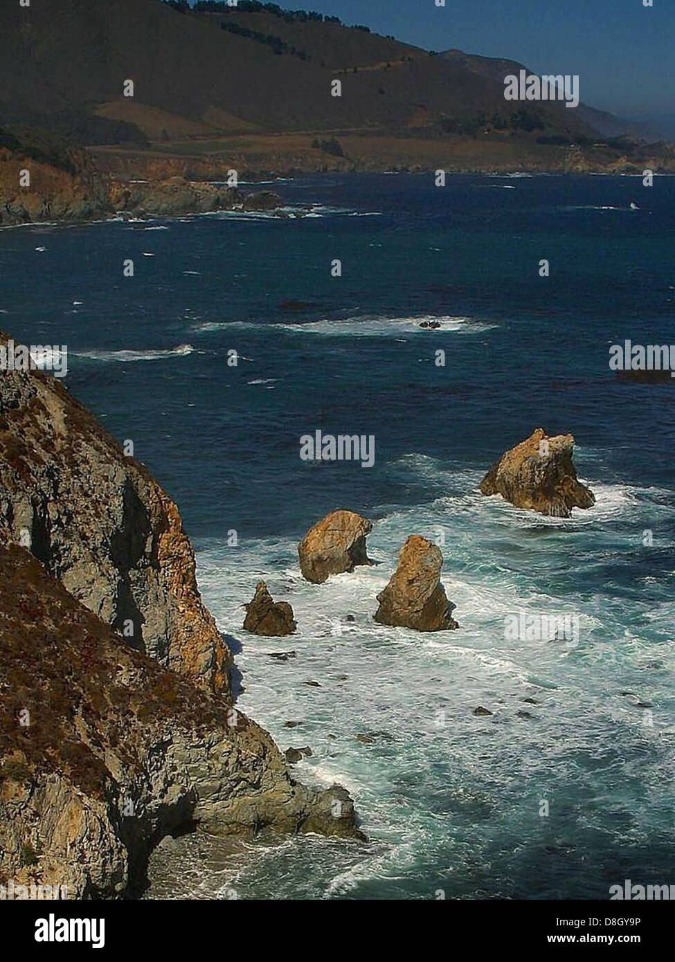 A dramatic view of cliffs overlooking the sea, where steep rock faces ...