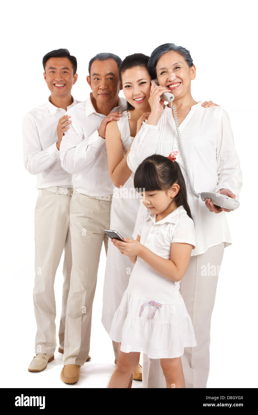 Whole family making phone call Stock Photo - Alamy