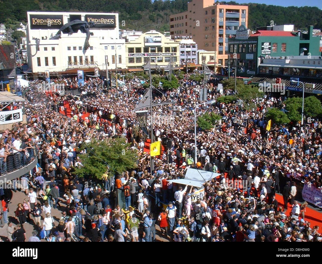 A crowded movie theater filled with fans eagerly watching a screening ...