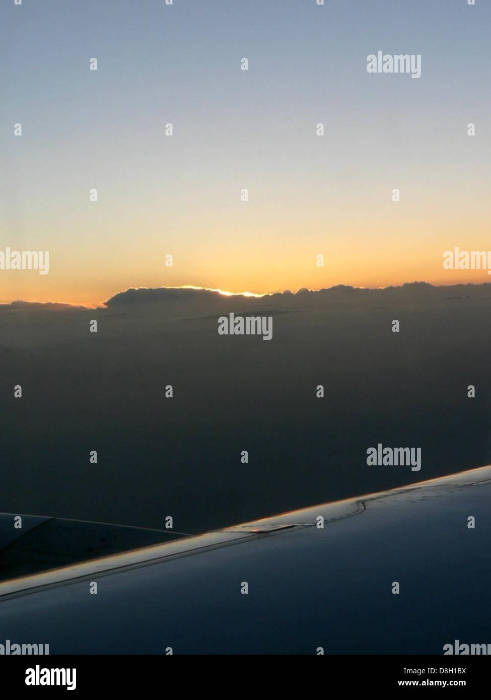 Dawn above clouds Stock Photo - Alamy