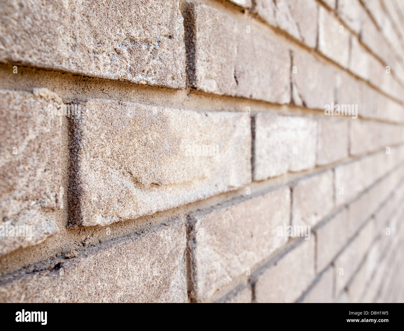 old brick wall viewed at angle with shallow depth of field with lines ...