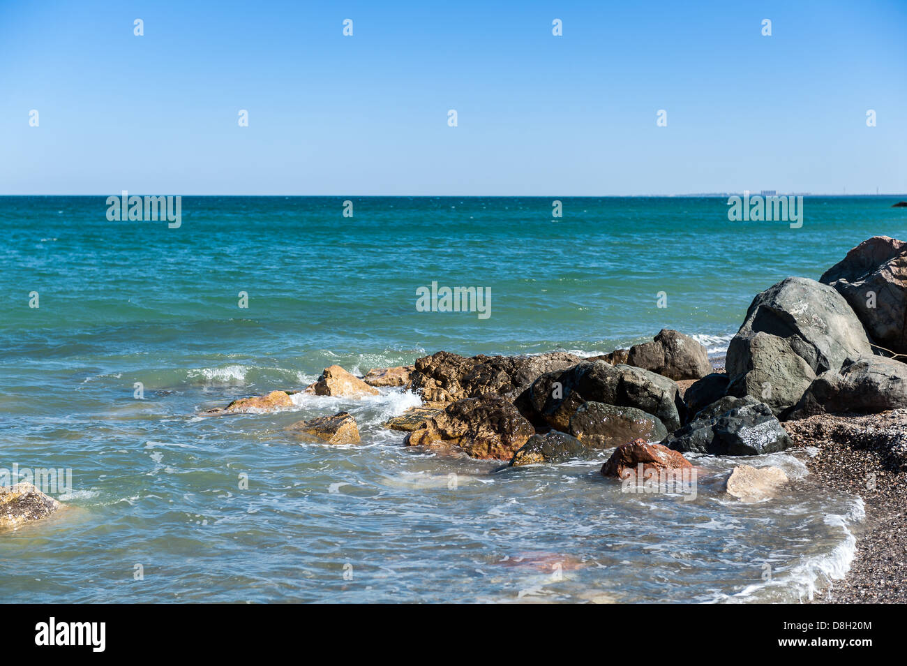 Stone face on the beach Stock Photo - Alamy
