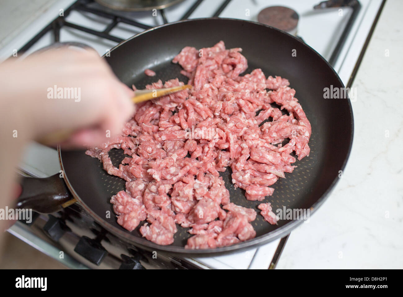 Minced meat on frying pan Stock Photo - Alamy