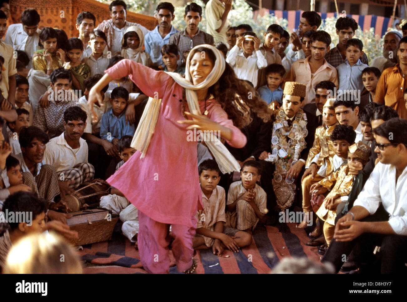 boy dancing as a woman to entertain the Muslim men at a wedding Stock ...