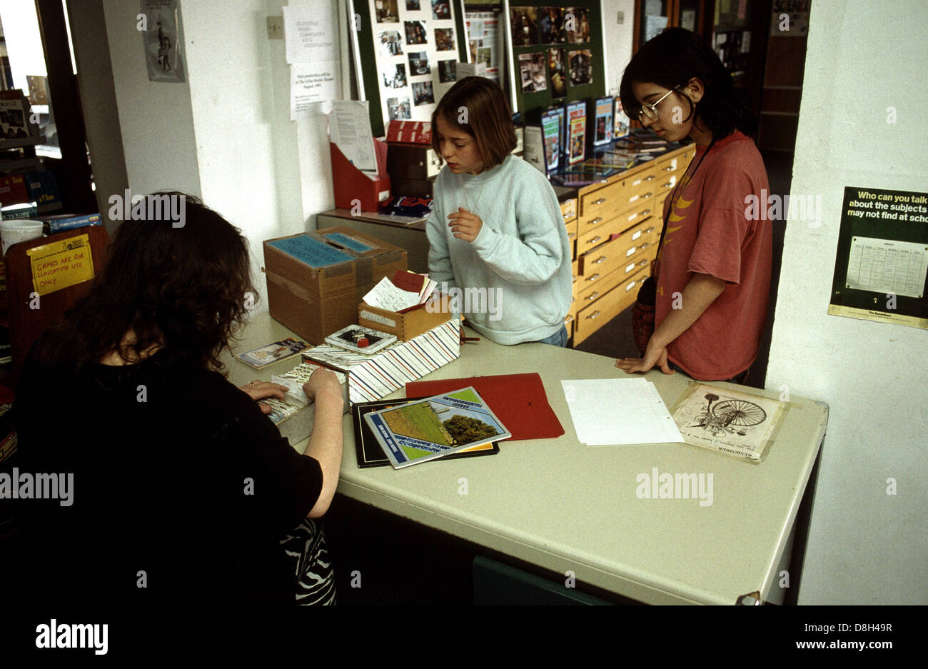 Checking out books library hi-res stock photography and images - Alamy