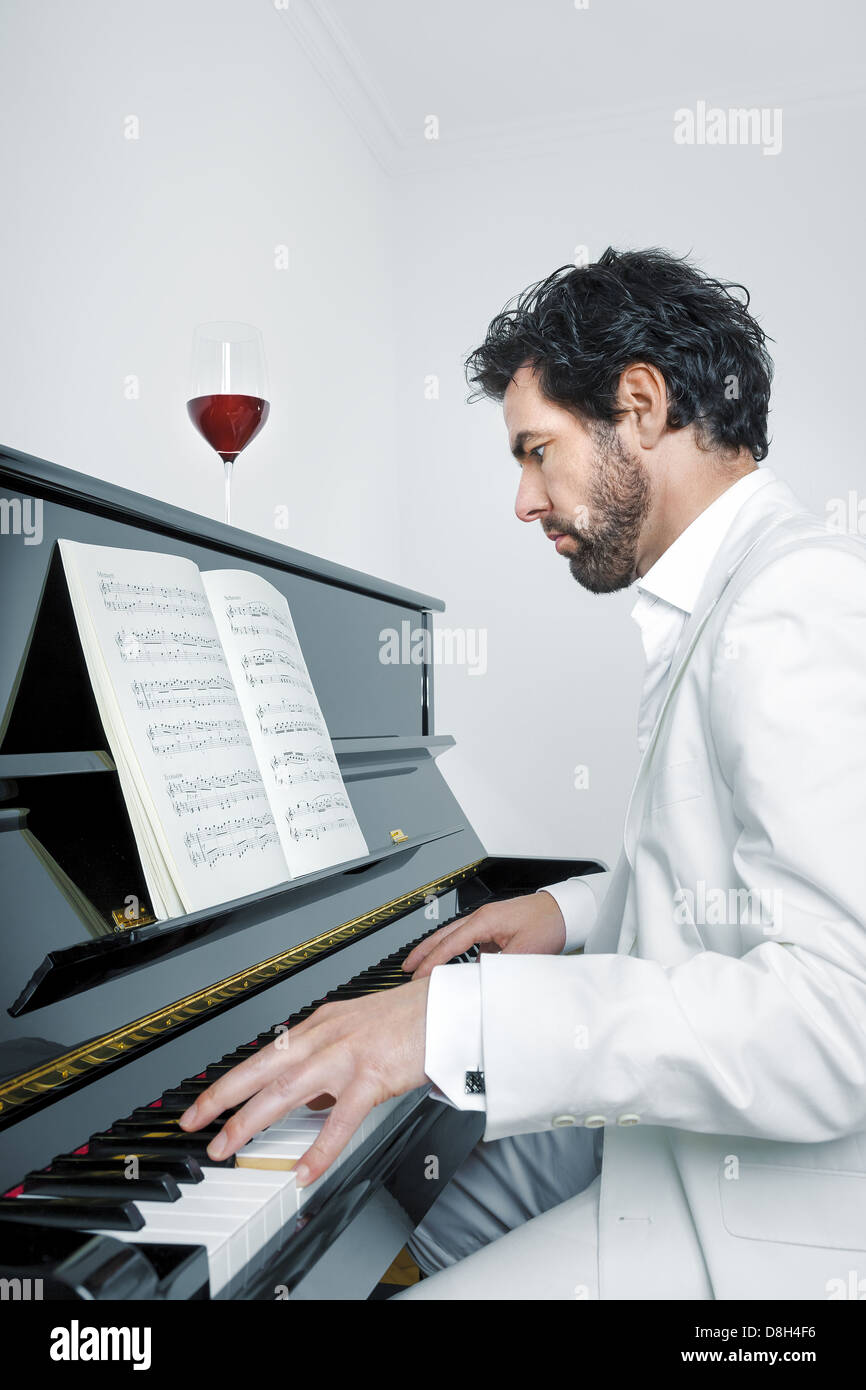 Playing piano suit hi-res stock photography and images - Alamy