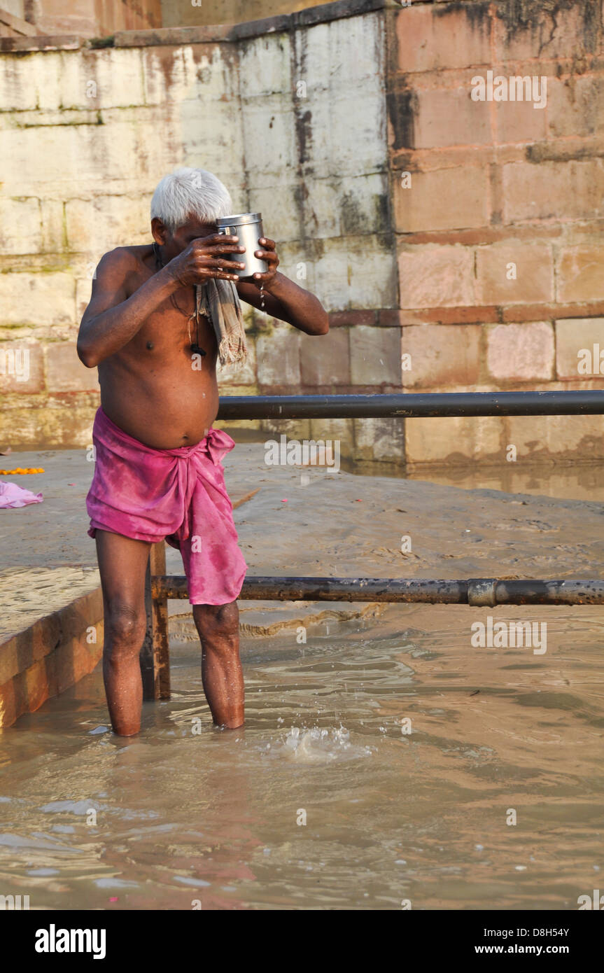 Pilgrims bathing in holy river hi-res stock photography and images - Alamy