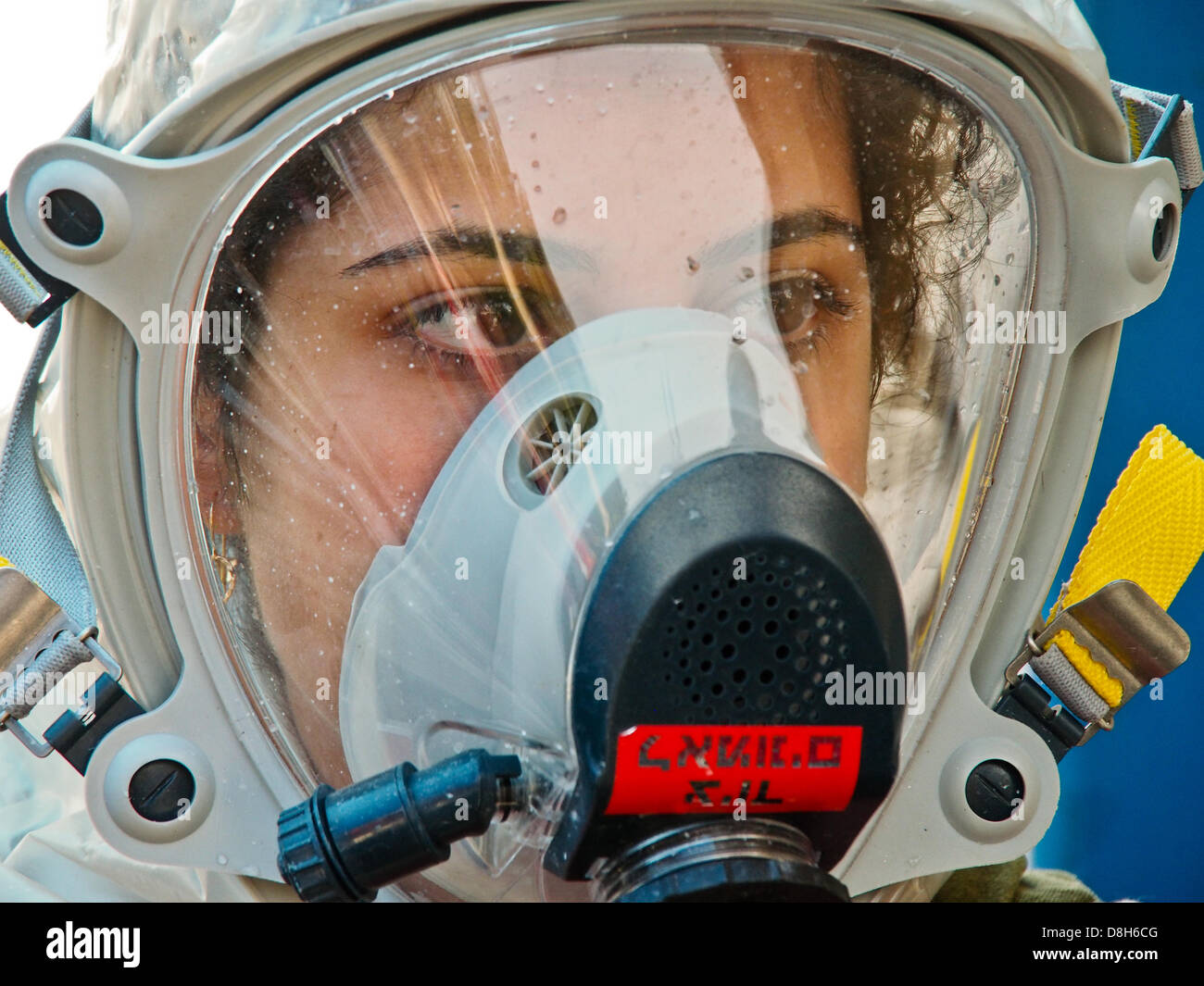 Jerusalem, Israel. 29th May 2013. A young woman wears a protective mask ...