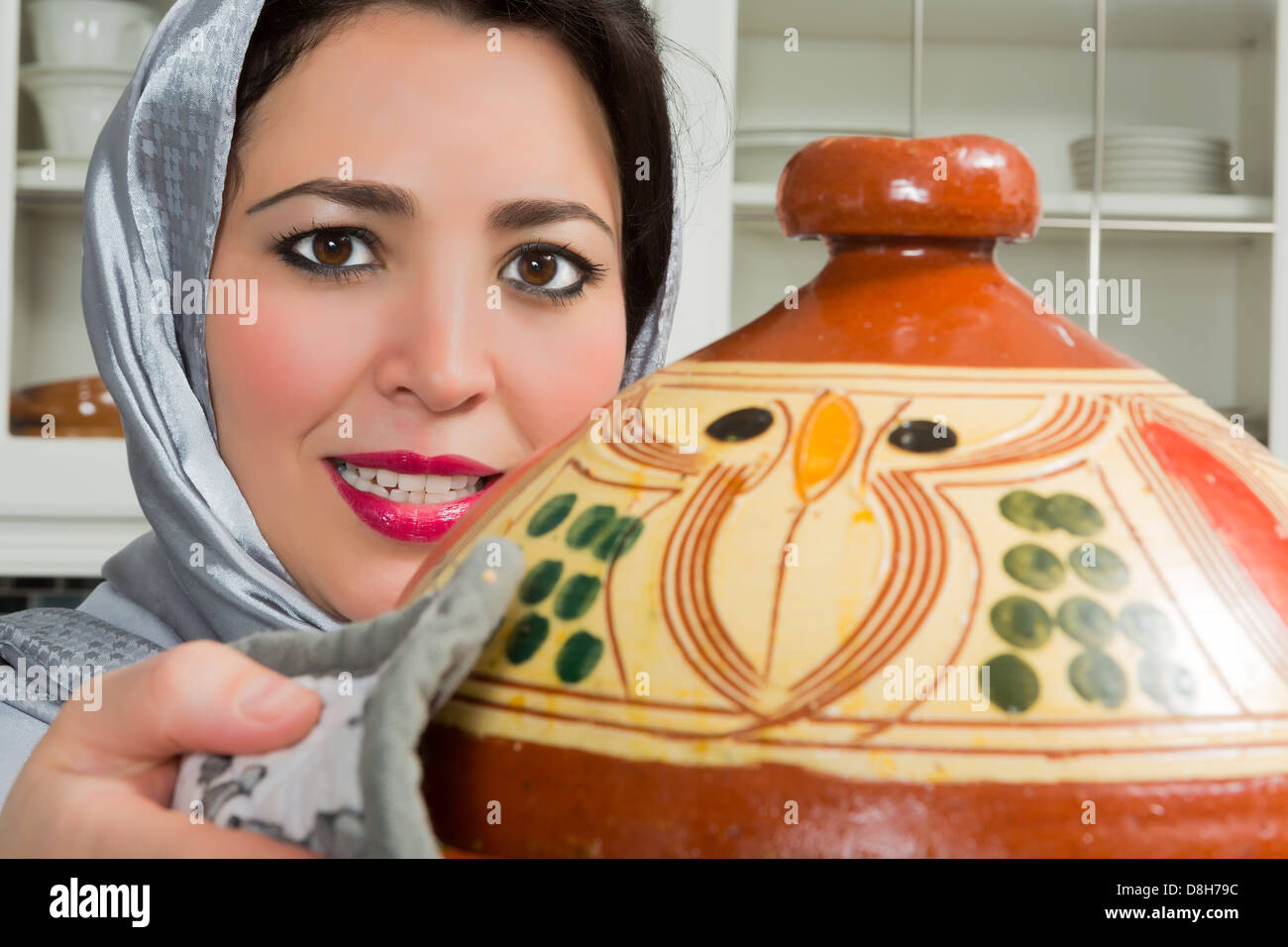 Moroccan immigrant woman in Europe presenting her tajine dish during ...