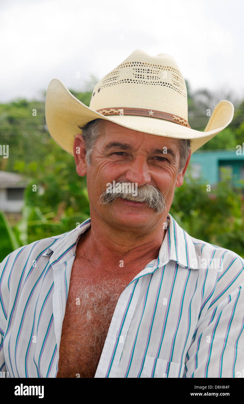 Trinidad Cuba real cowboy on horse riding on road portrait from ranch ...
