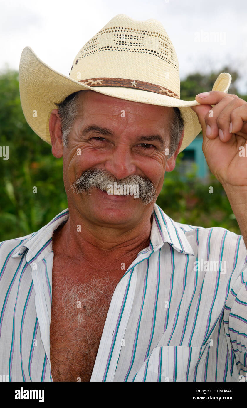 Trinidad Cuba real cowboy on horse riding on road portrait from ranch ...