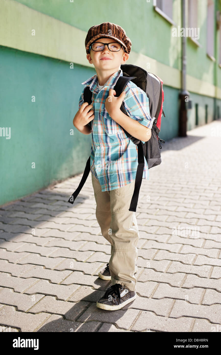 Time for school. Dreamy kid with backpack Stock Photo - Alamy