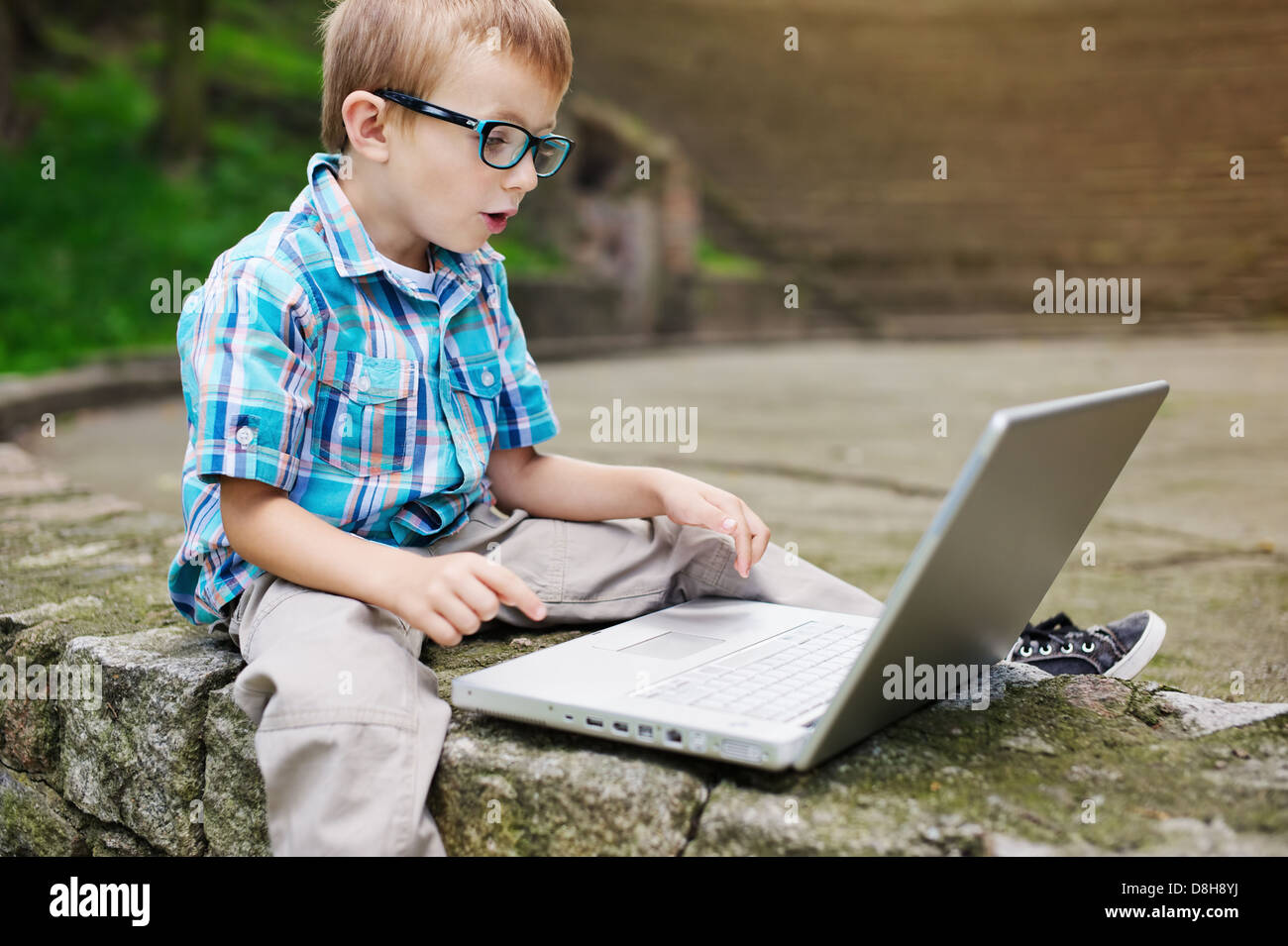 Young boy surprised by wireless internet Stock Photo - Alamy