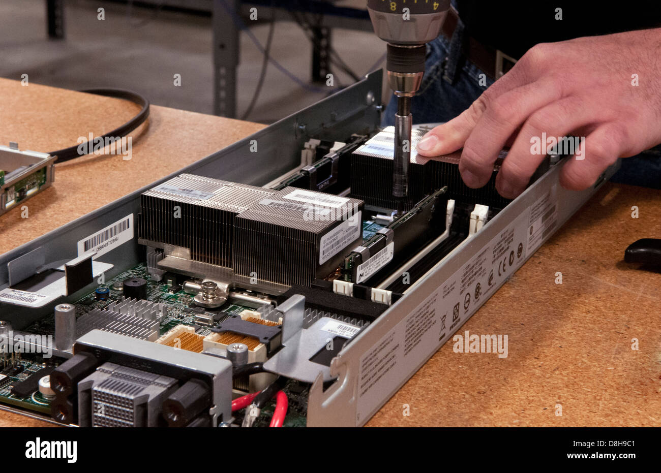 Close up of technician assembling server for computer IT company for ...