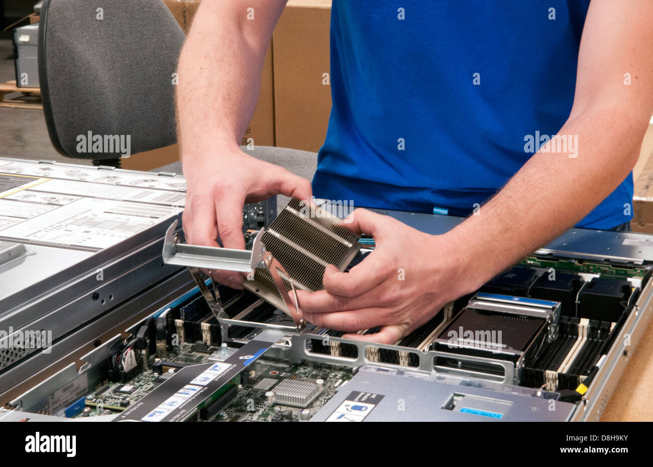 Close up of technician assembling server for computer IT company for ...