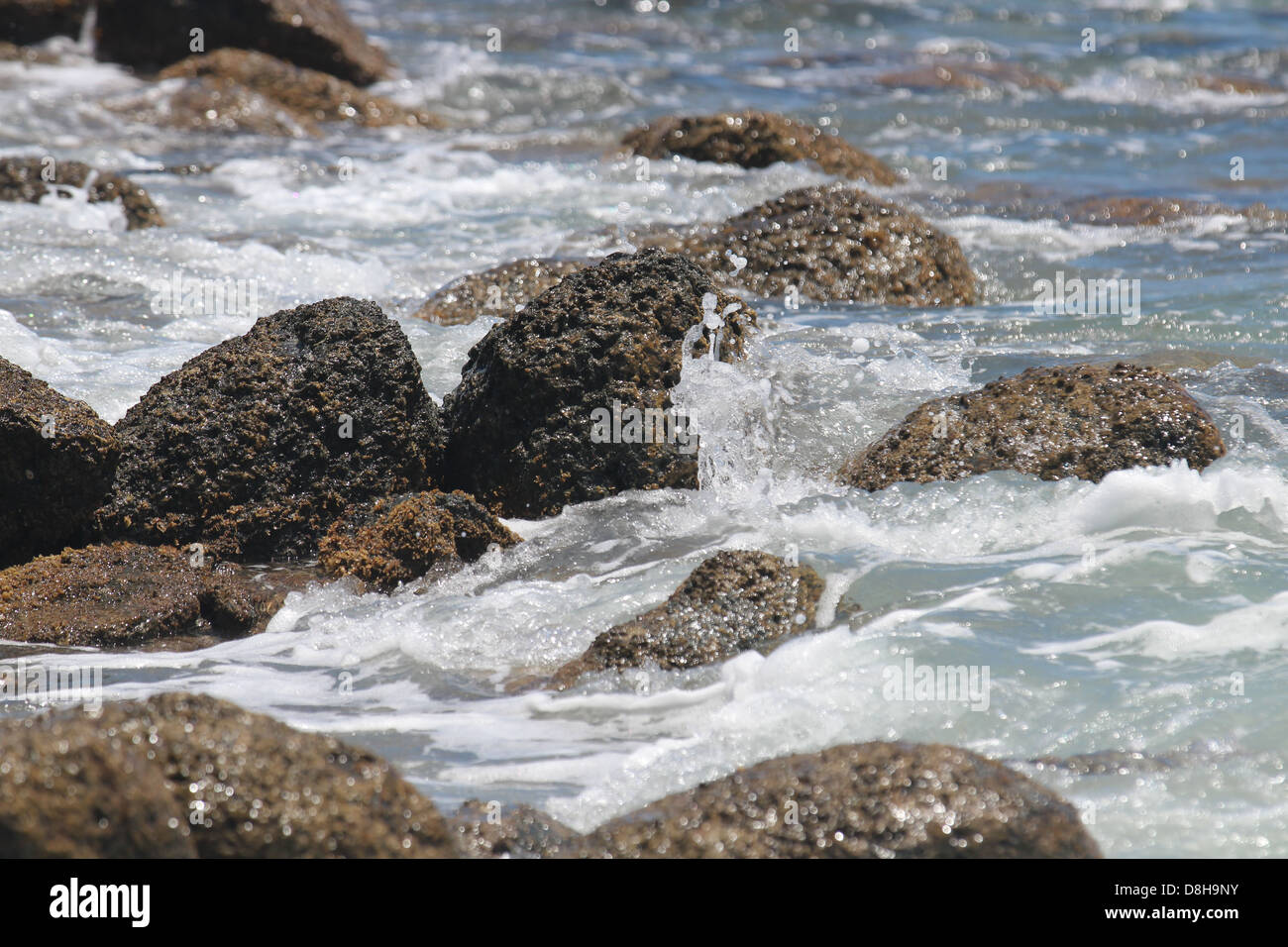 waves hitting the rocks in the ocean Stock Photo - Alamy