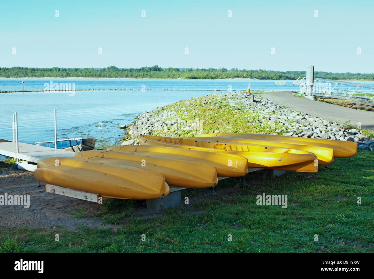 Bright yellow canoes hi-res stock photography and images - Alamy