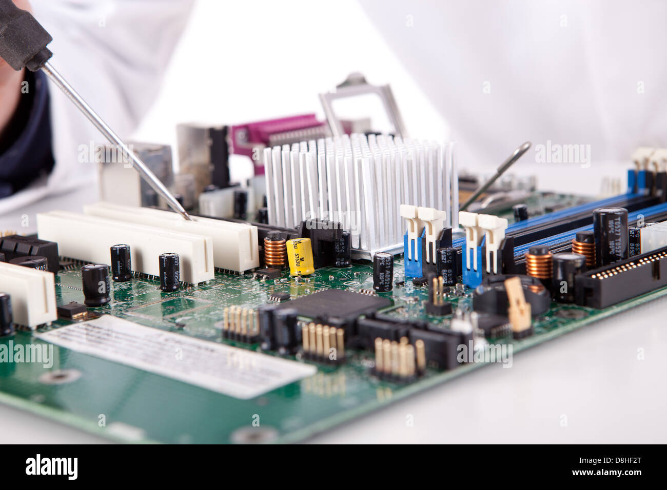 Computer engineer working on an old motherboard Stock Photo - Alamy